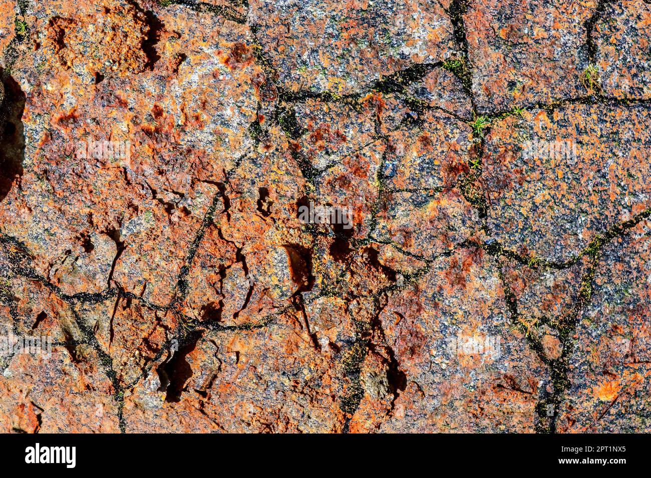 Detailed close up surface of rusty metal and stone with lots of ...