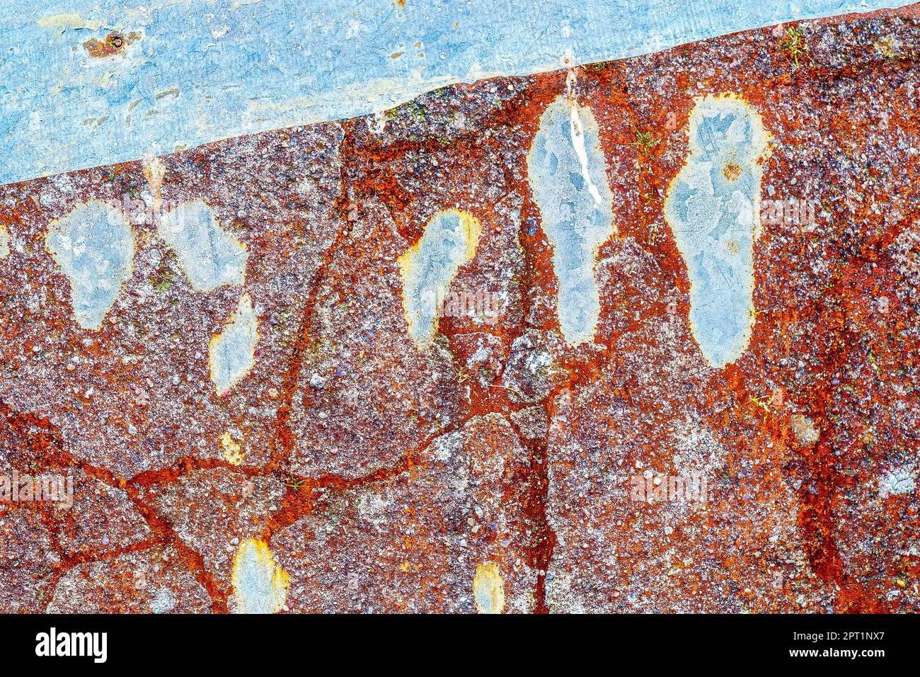 Detailed close up surface of rusty metal and stone with lots of ...