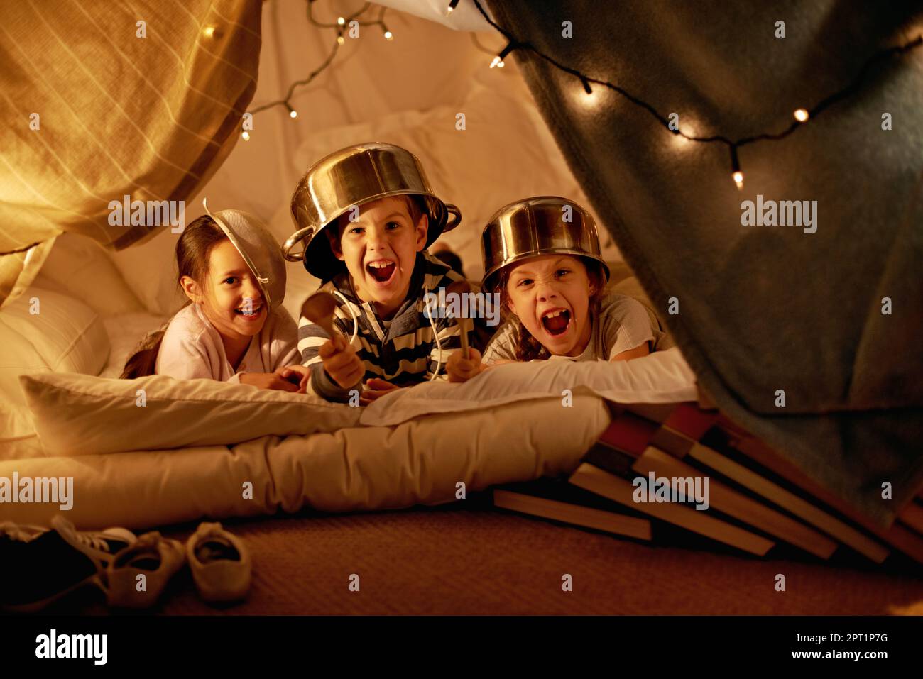 Repel the invaders. cute little children with pot helmets in a blanket ...