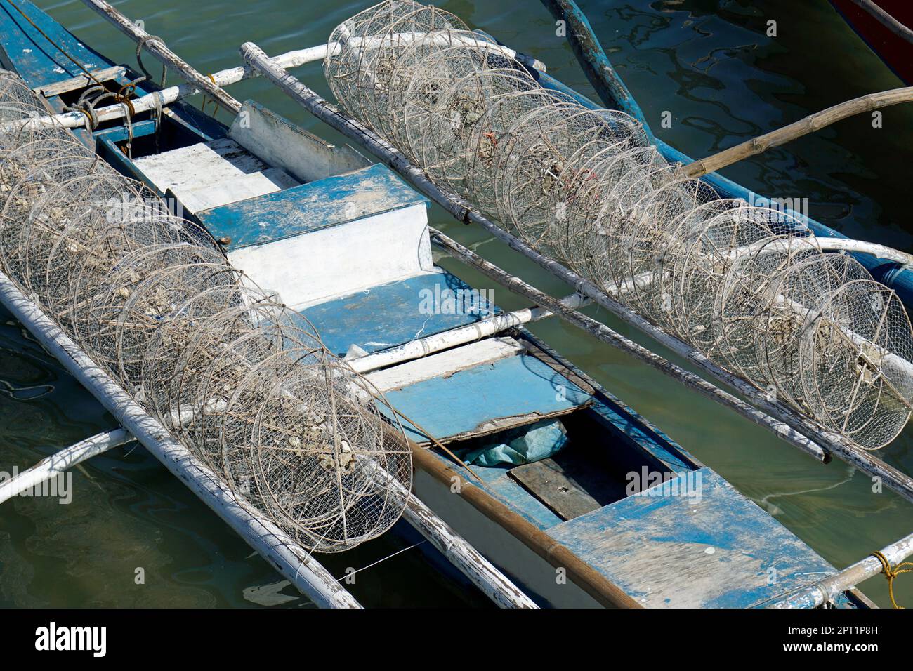 traditional small wooden outrigger boats at a fisherman village Stock ...