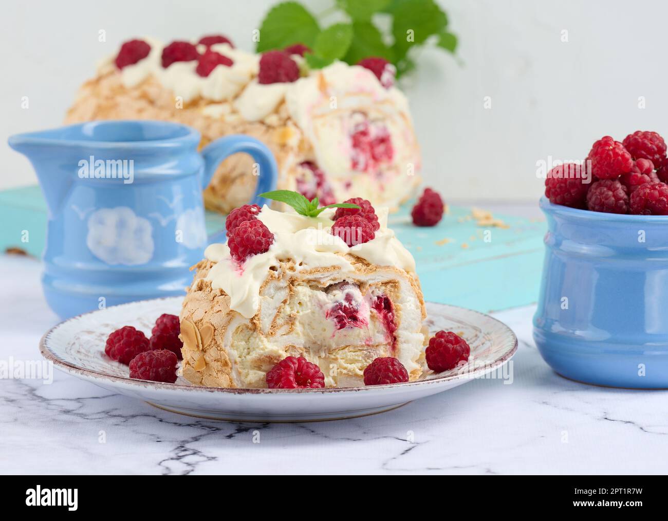 Baked meringue roll with cream and fresh red raspberry, white ...