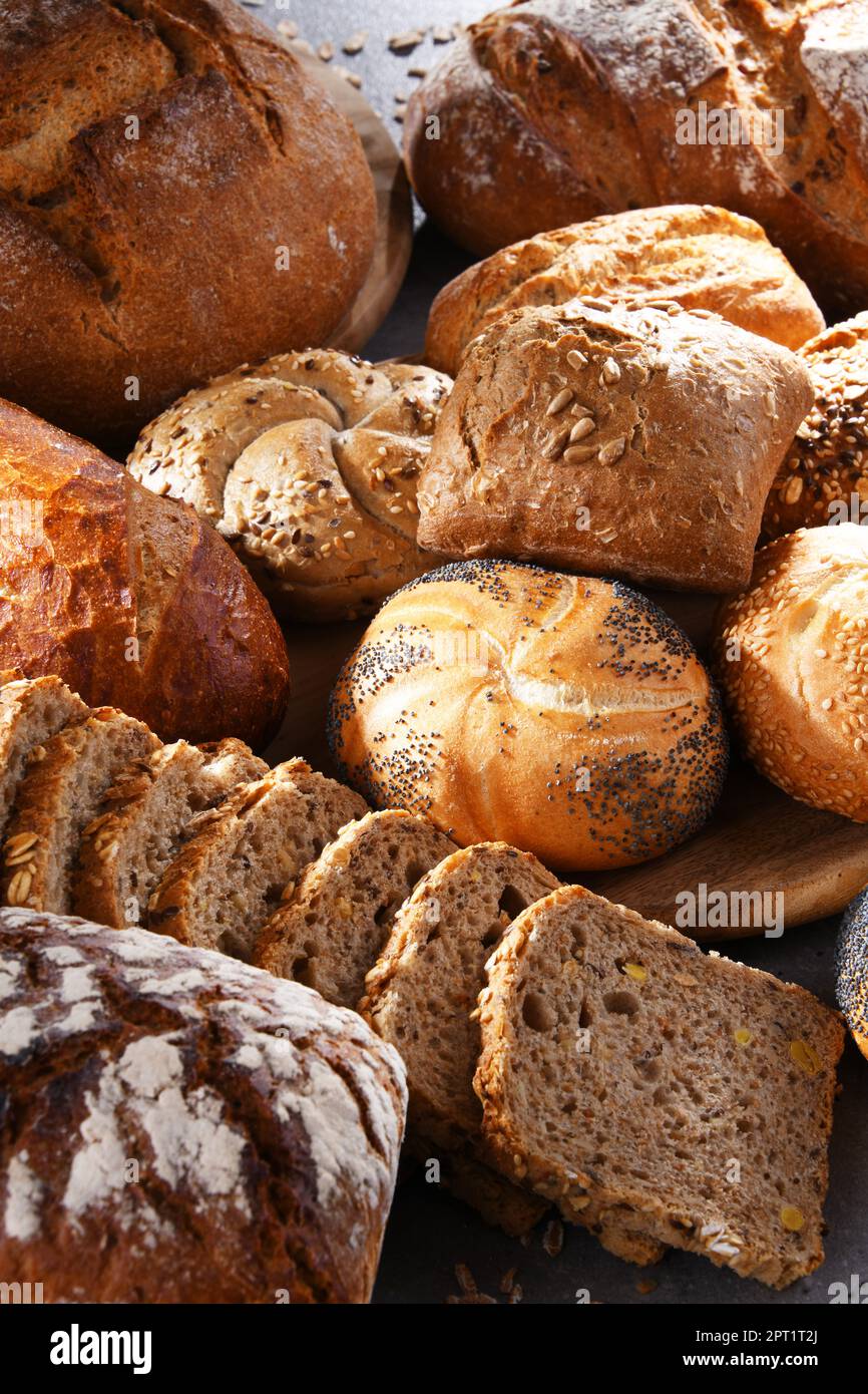 Assorted bakery products including loafs of bread and rolls Stock Photo ...