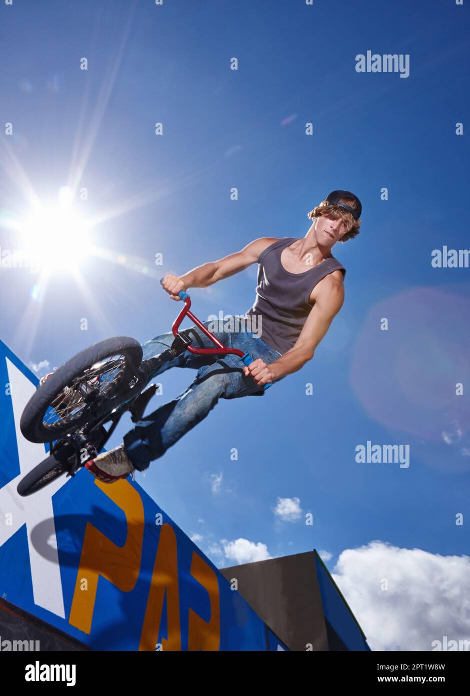 Practicing for the x games. Full length shot of a teenage boy riding a ...