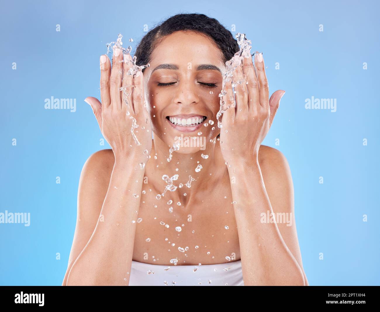 Skincare, water and woman washing face for clean, healthy and natural ...