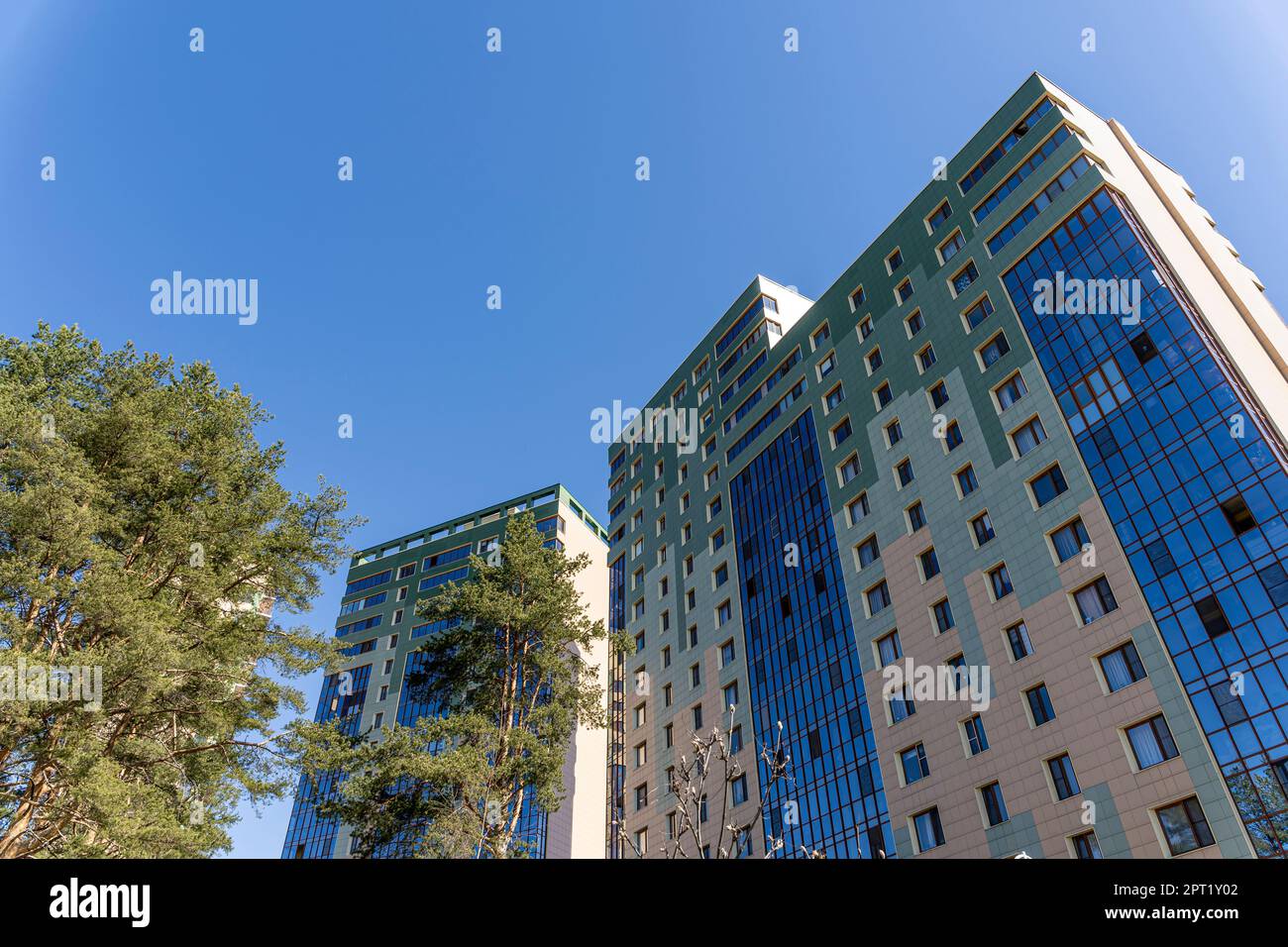 a tall high-rise building finished with glass Stock Photo - Alamy
