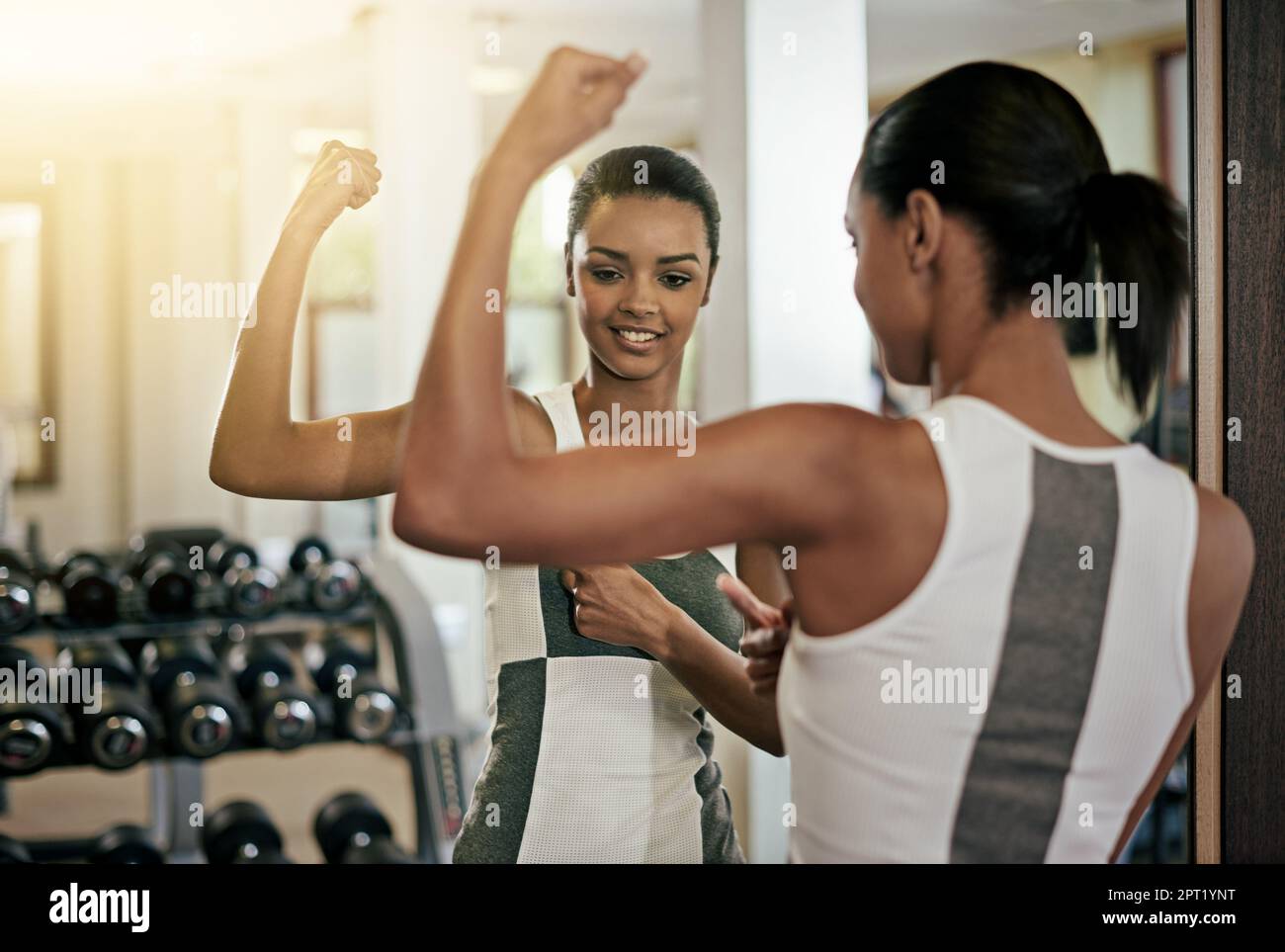 Women flexing muscles in gym hi-res stock photography and images - Alamy