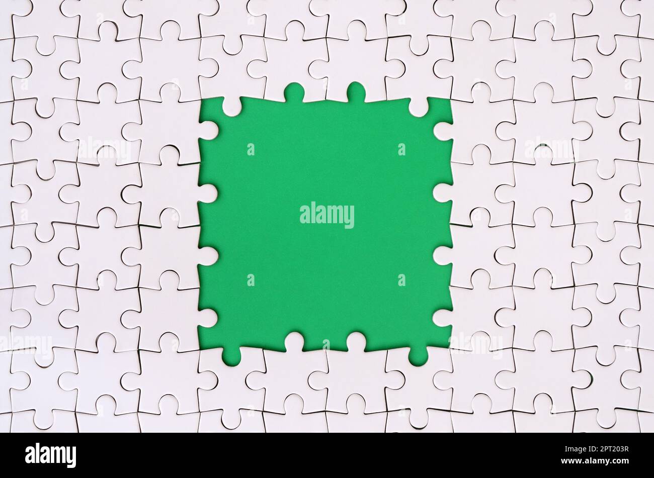 Framing in the form of a rectangle, made of a white jigsaw puzzle ...