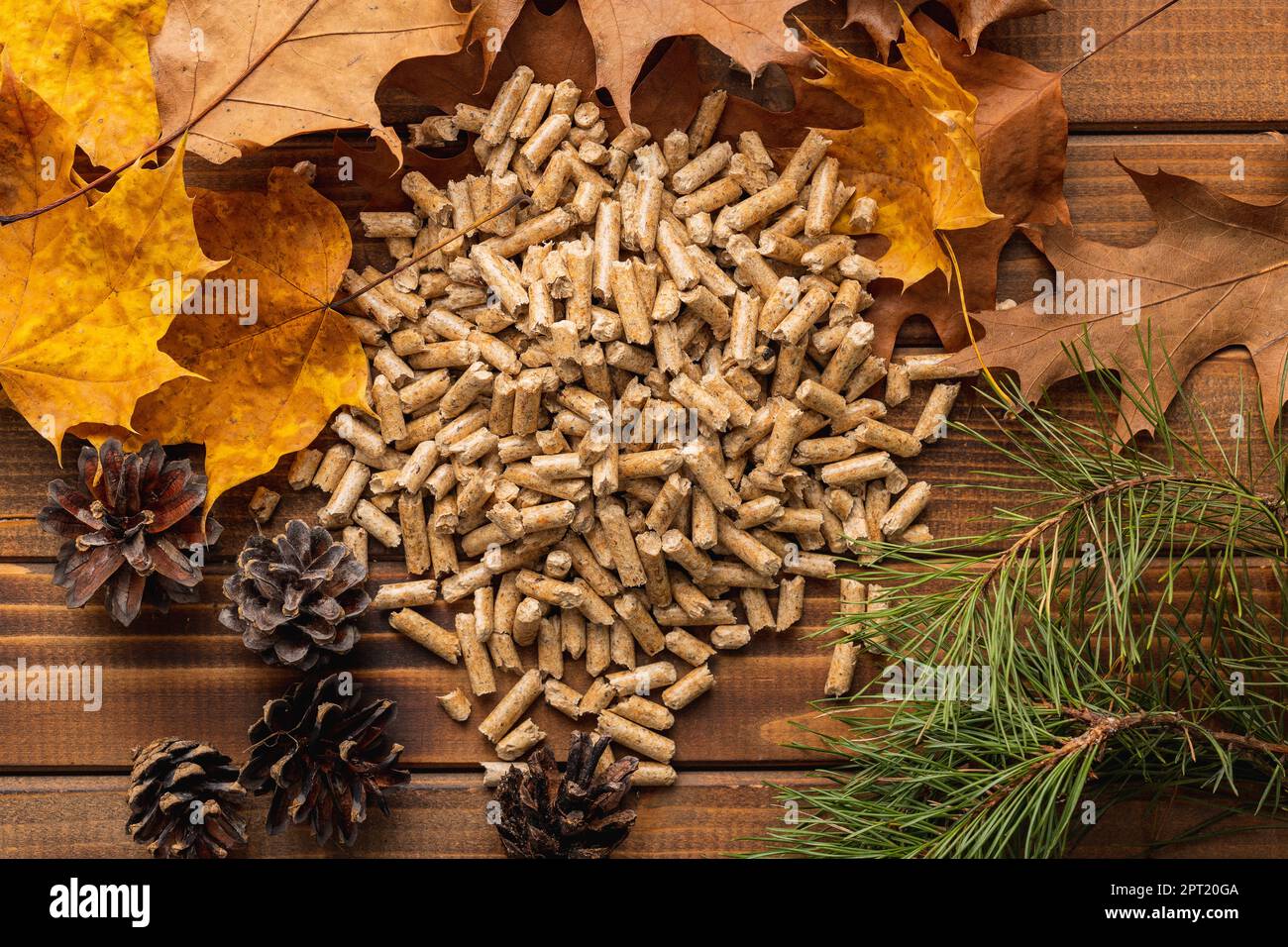 Wooden pellets on the wooden table. Top view Stock Photo - Alamy
