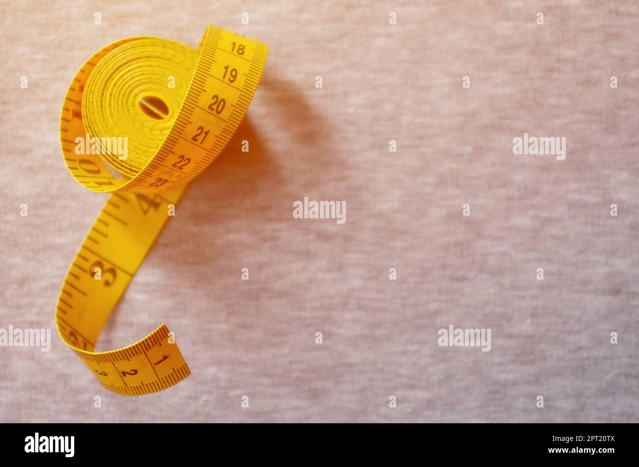 The measuring tape of yellow color with numerical indicators in the ...