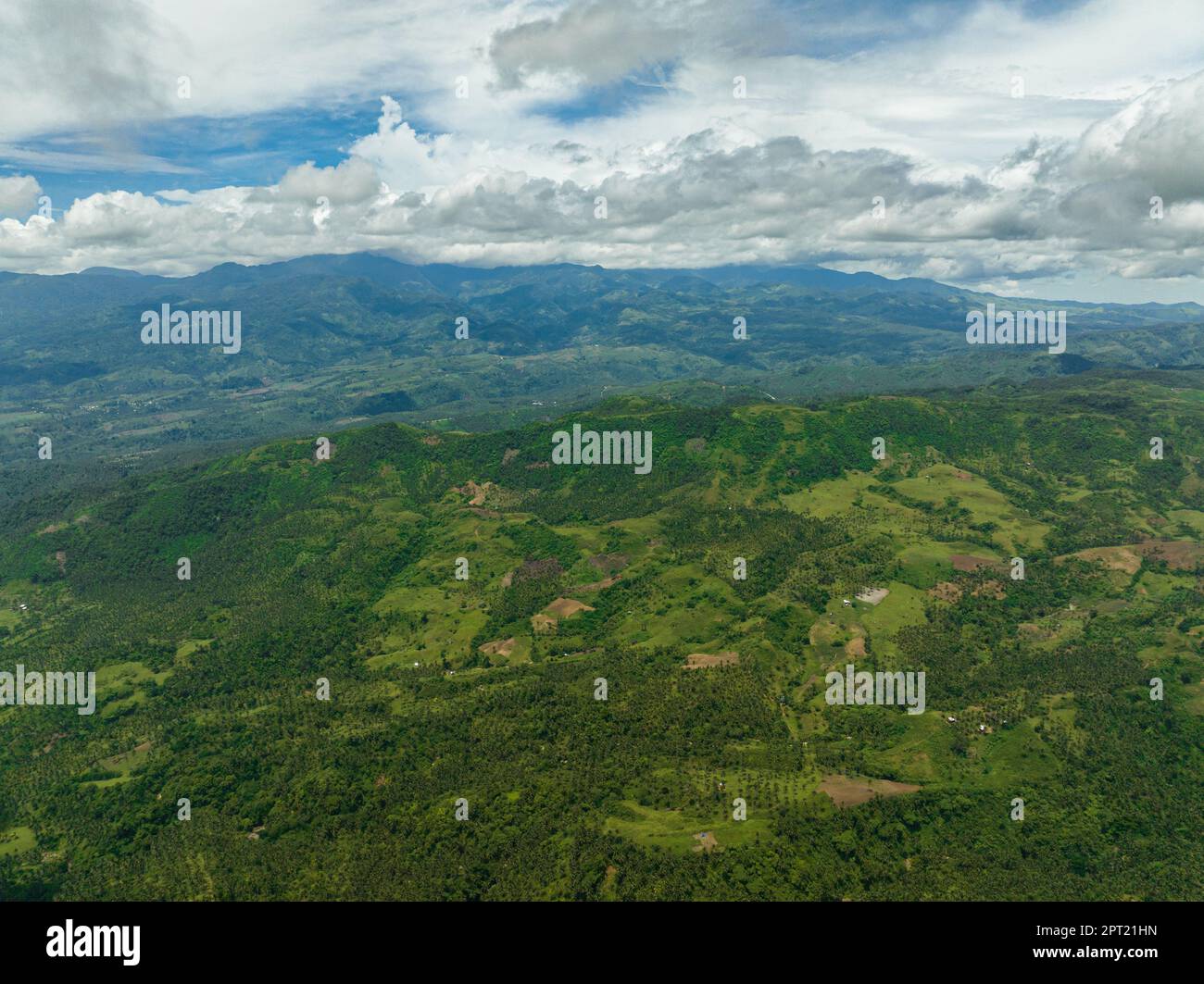 Mountain landscape with green hills and farmland. Negros, Philippines ...