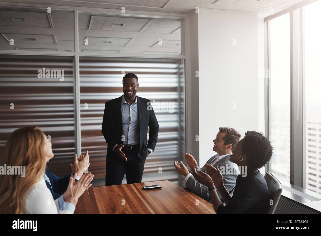 His hard work deserves all the merit. a group of businesspeople ...