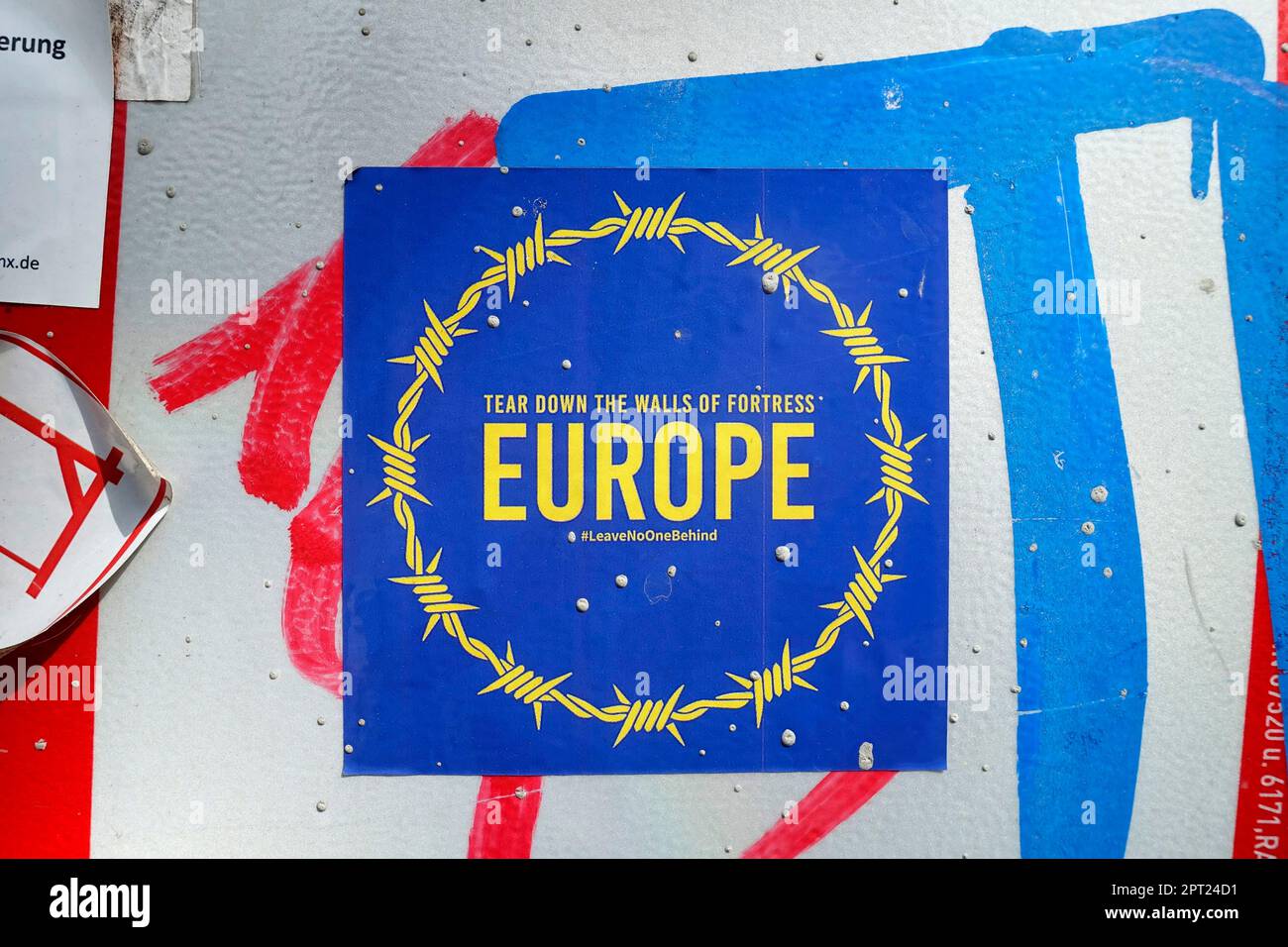 Sticker of Leave no one behind, Razor wire, Berlin, Germany Stock Photo ...