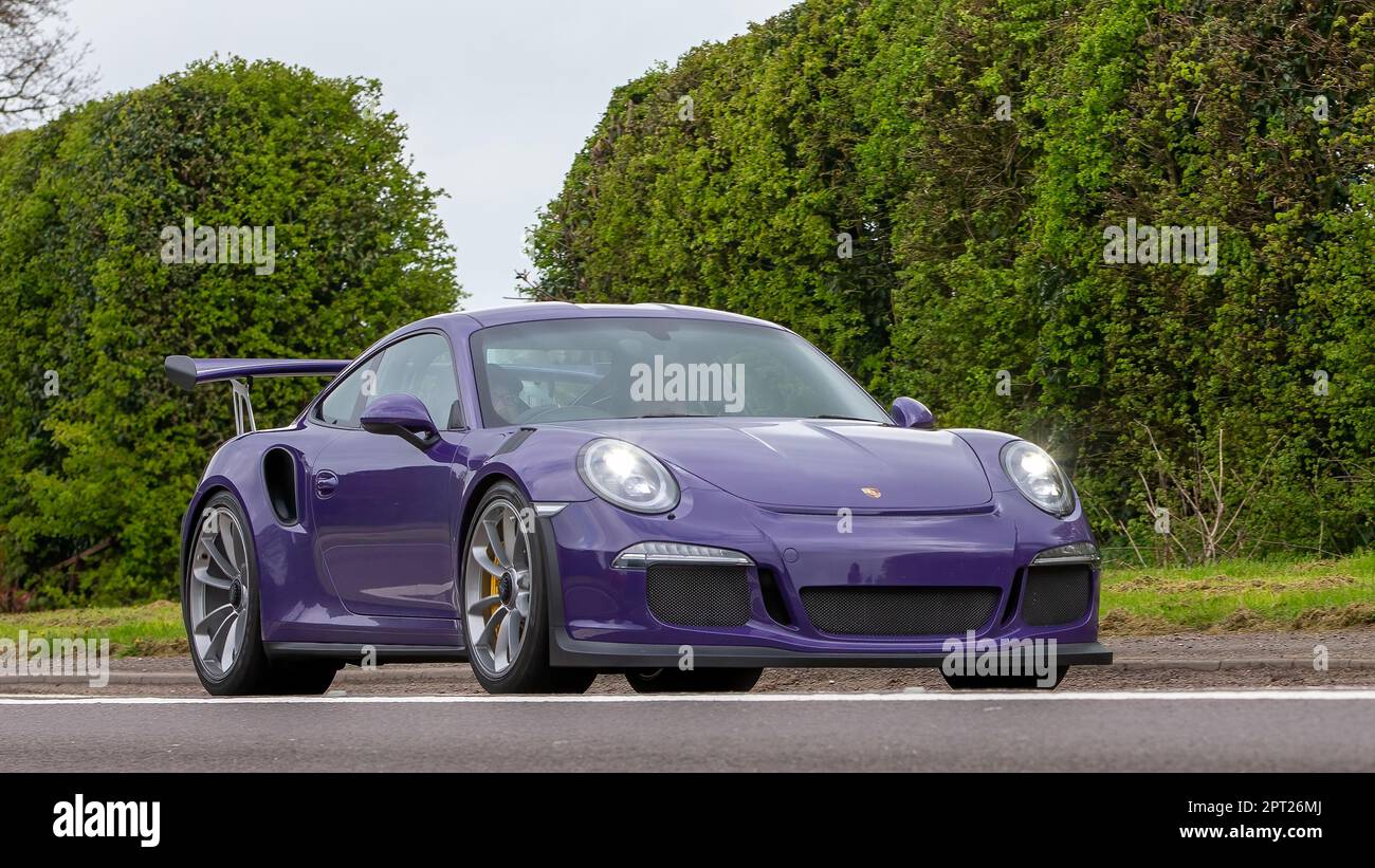 Bicester,Oxon,UK - April 23rd 2023. 2016 purple Porsche 911 travelling ...