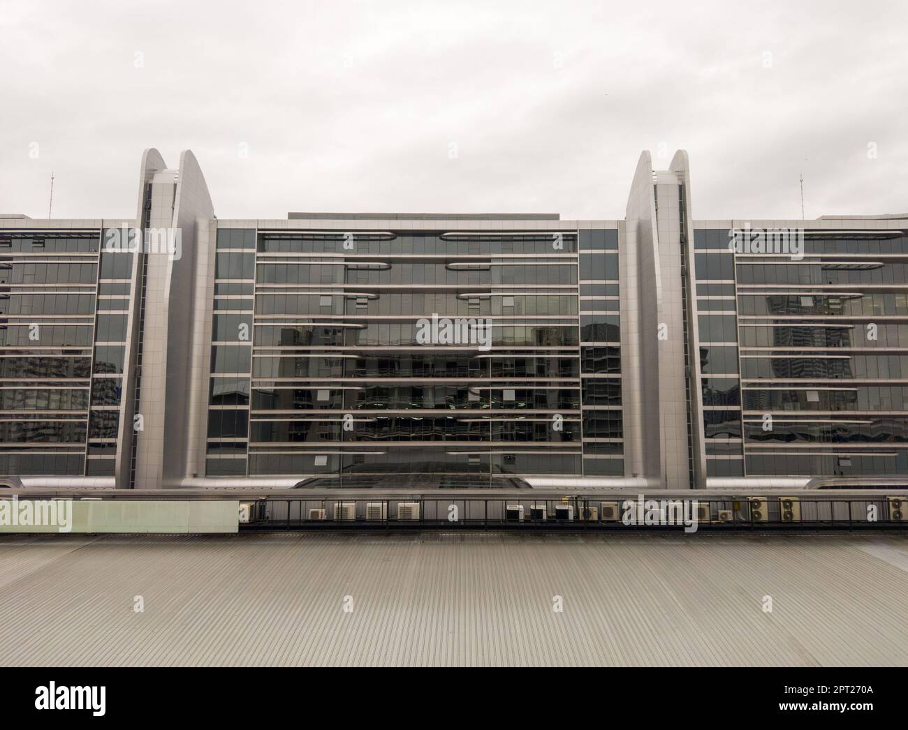 The air compressor units are arranged in a row on the roof in front of ...