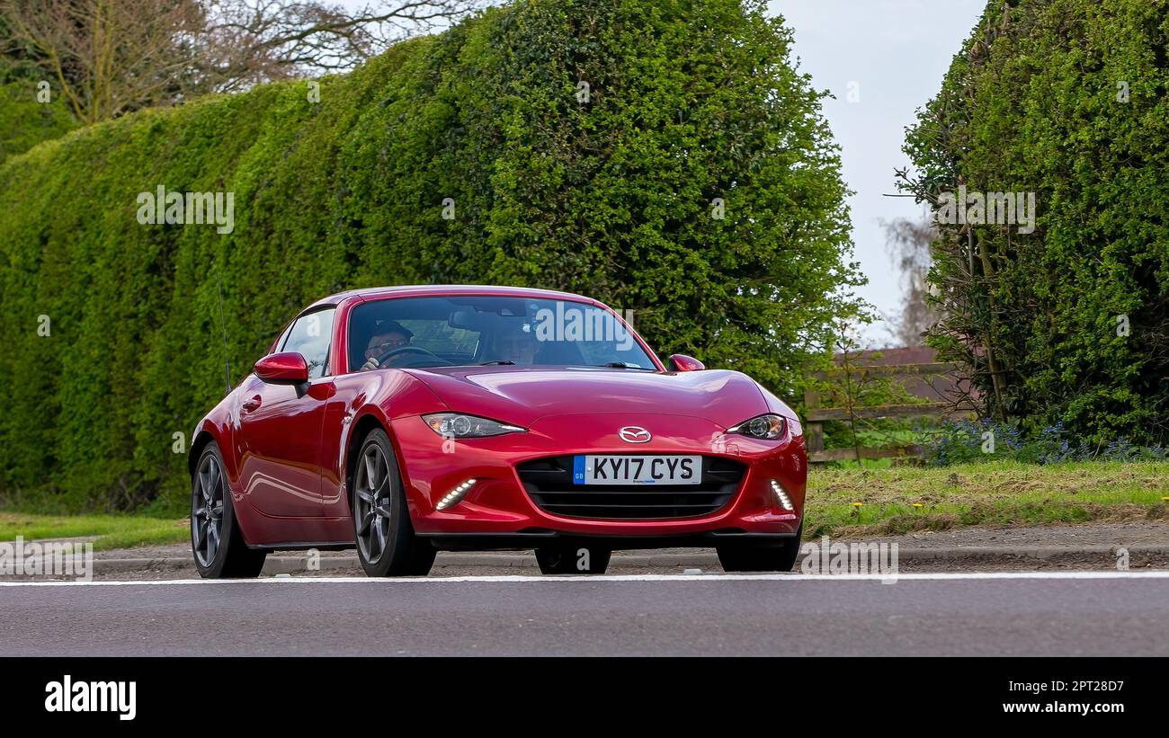 Bicester,Oxon,UK - April 23rd 2023.2017 red MAZDA MX-5 car travelling ...