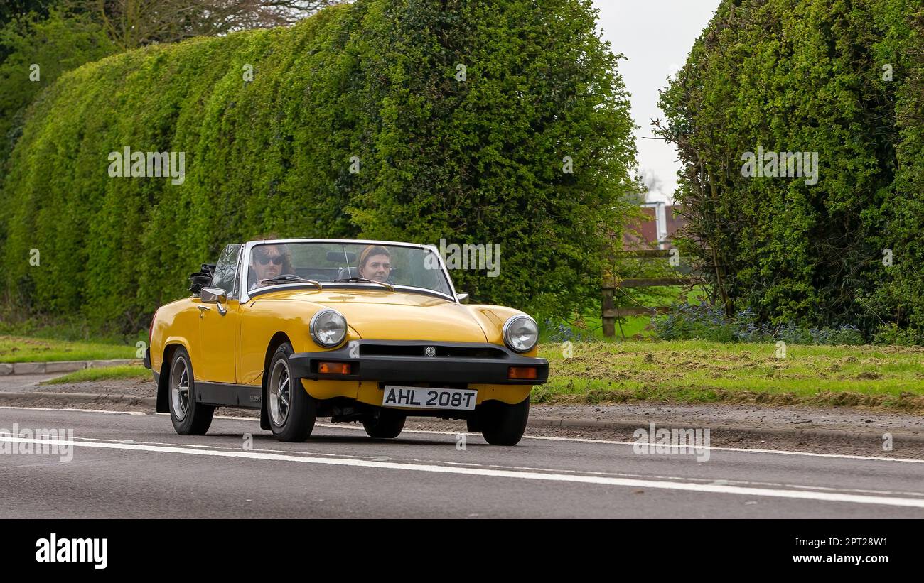Bicester,Oxon,UK - April 23rd 2023. 1979 yellow MG MIDGET car ...