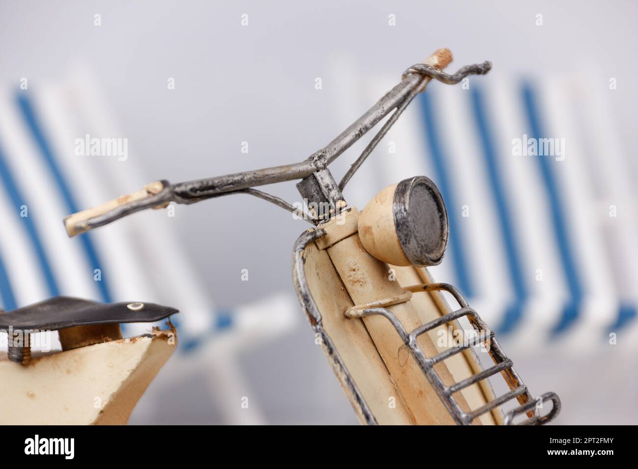 detailed view of motor scooter model on white table with white ...