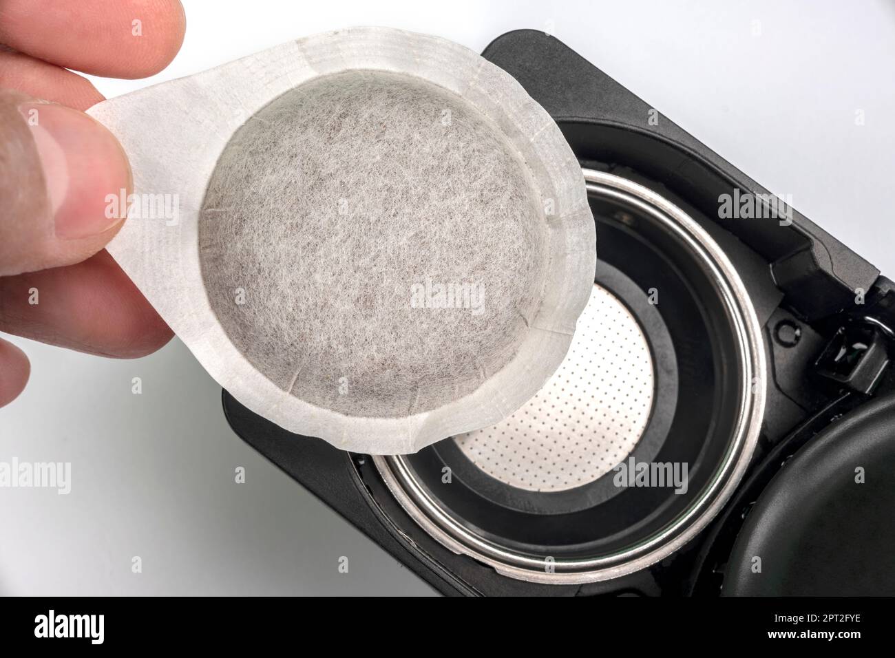 Person preparing coffee. Person putting coffee pod into coffee machine ...