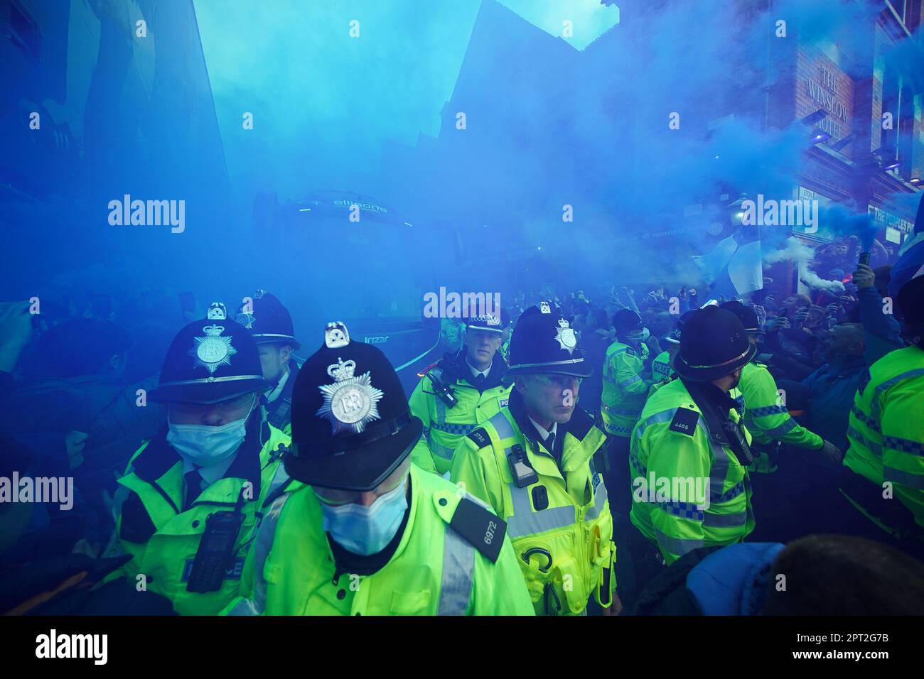 The Everton team bus arrives as police hold back Everton fans with ...