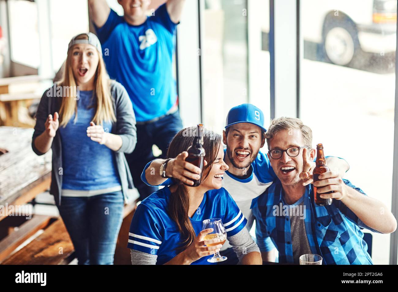 Football has the power to unite people. A group of excited friends ...