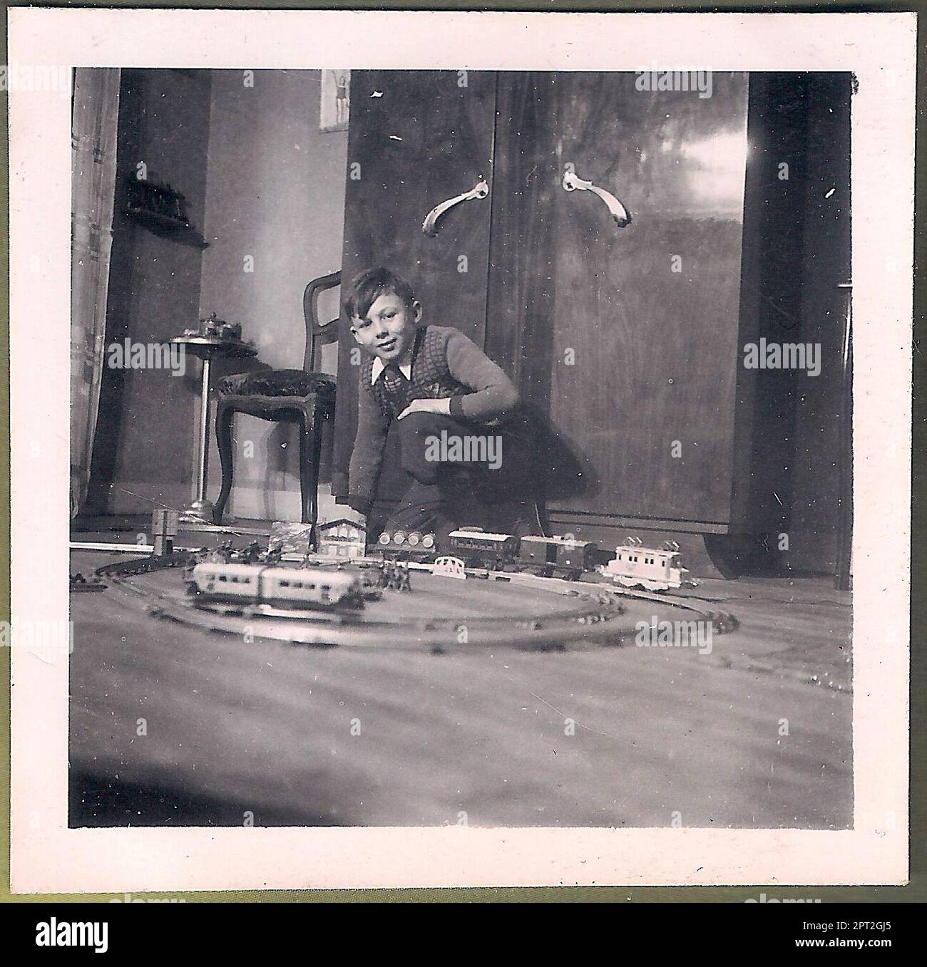 Boy playing with an electric train set (Christmas 1945 Stock Photo - Alamy