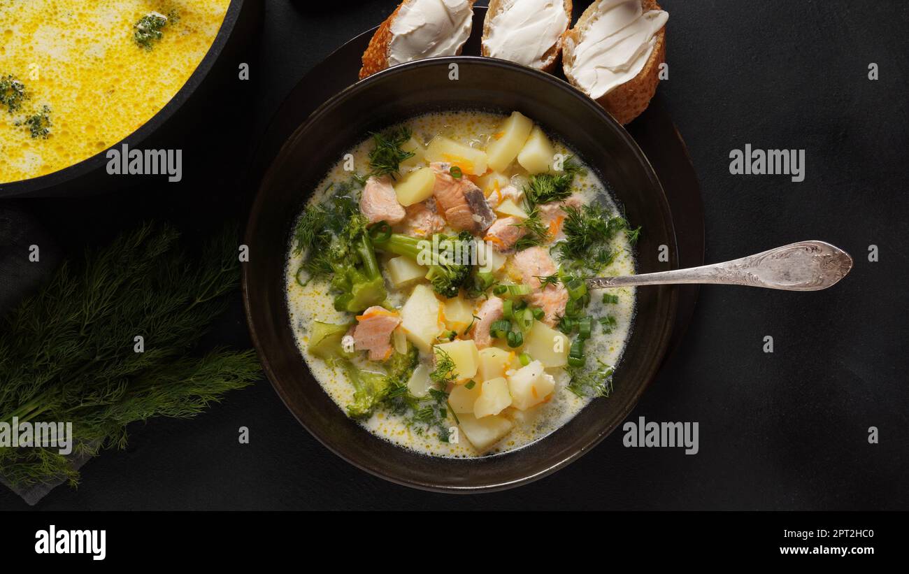 Creamy fish soup with salmon, potatoes, onions , carrots, dill and ...