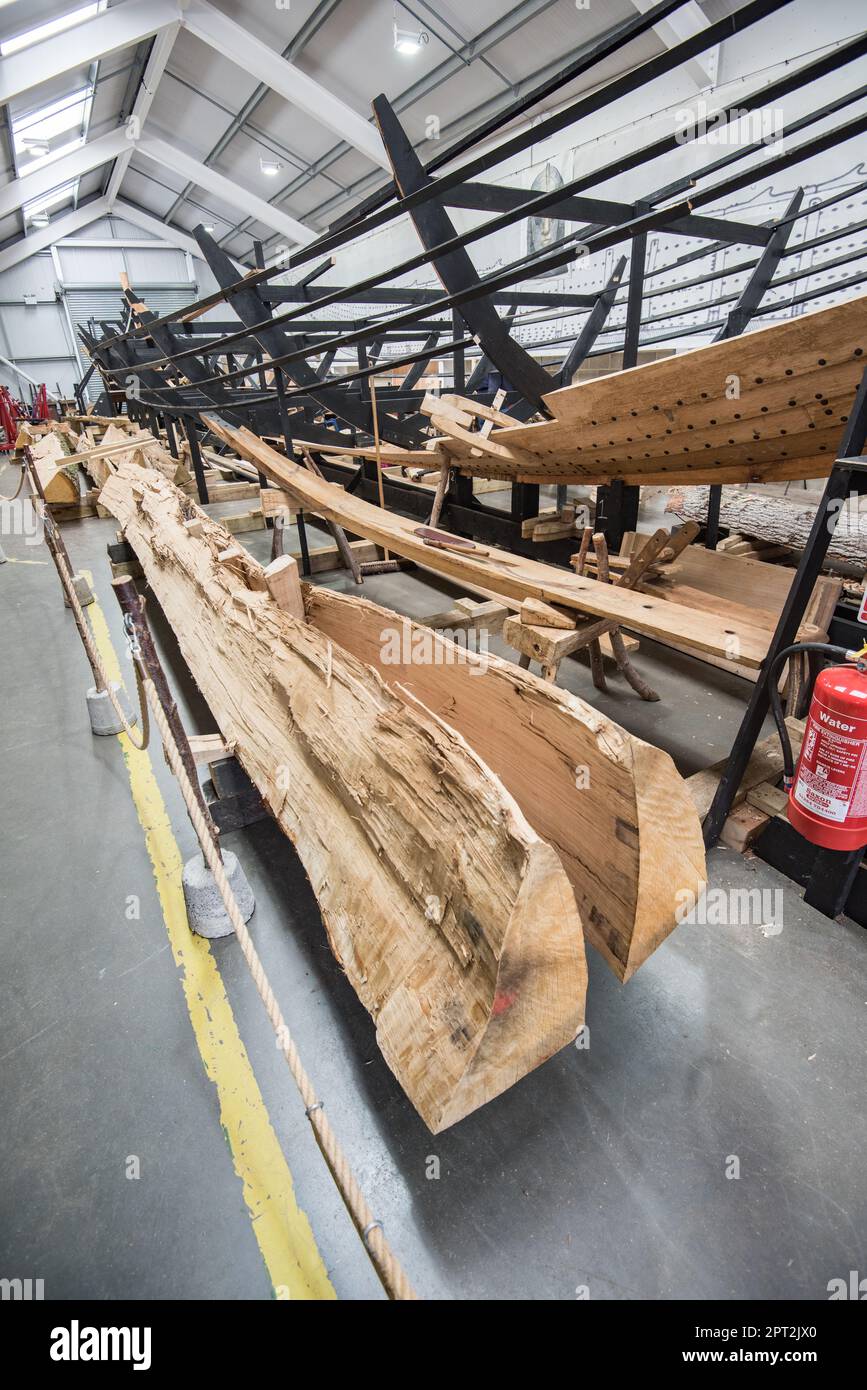 Wedges being used during cleaving, along the longitudinal. grain to ...