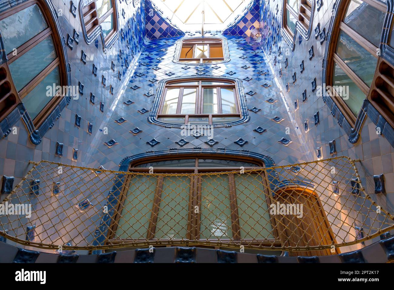 Inner courtyard of Casa Batlló decorated with a gradient mosaic from ...