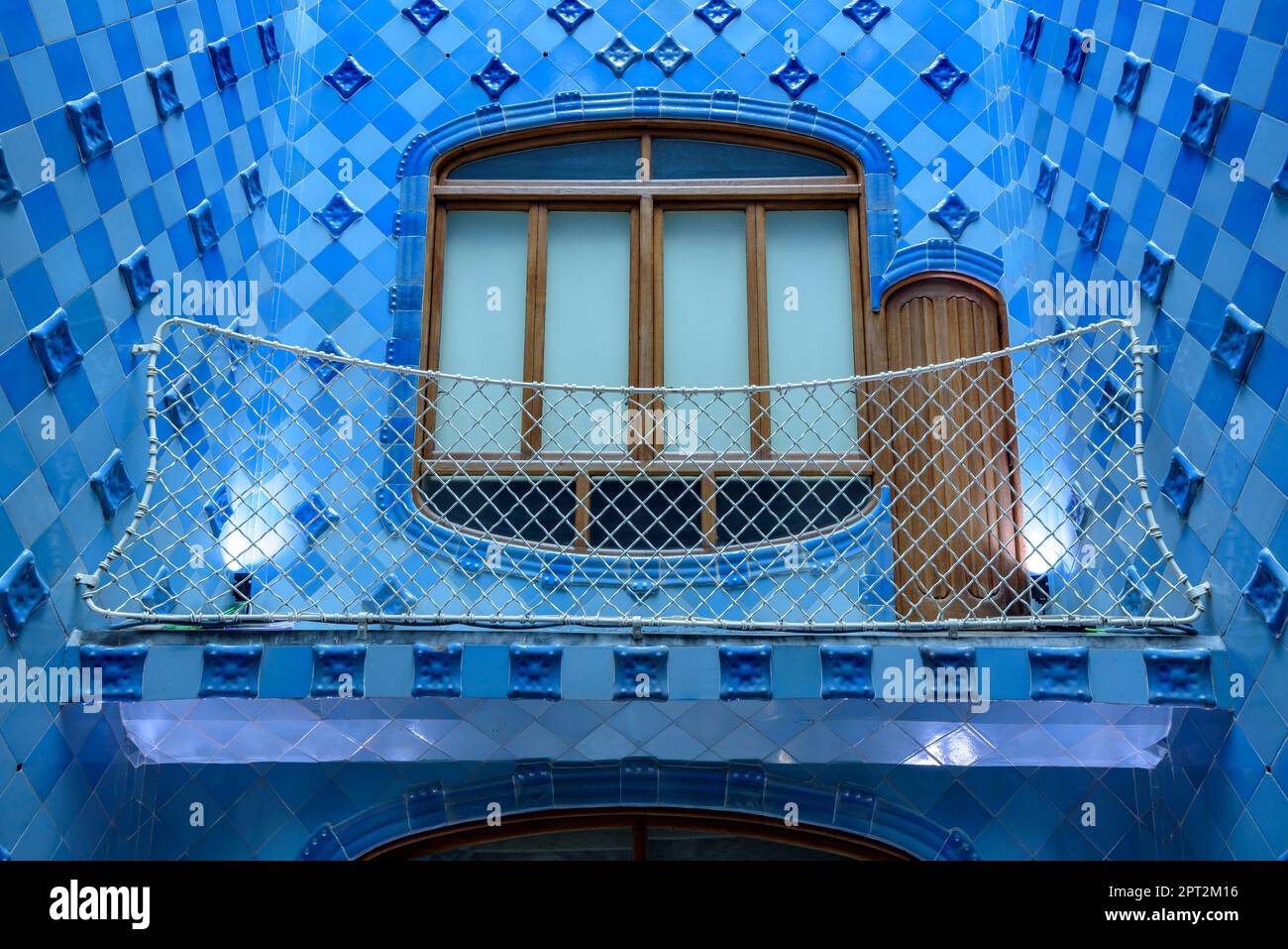 Inner courtyard of Casa Batlló decorated with a gradient mosaic from ...