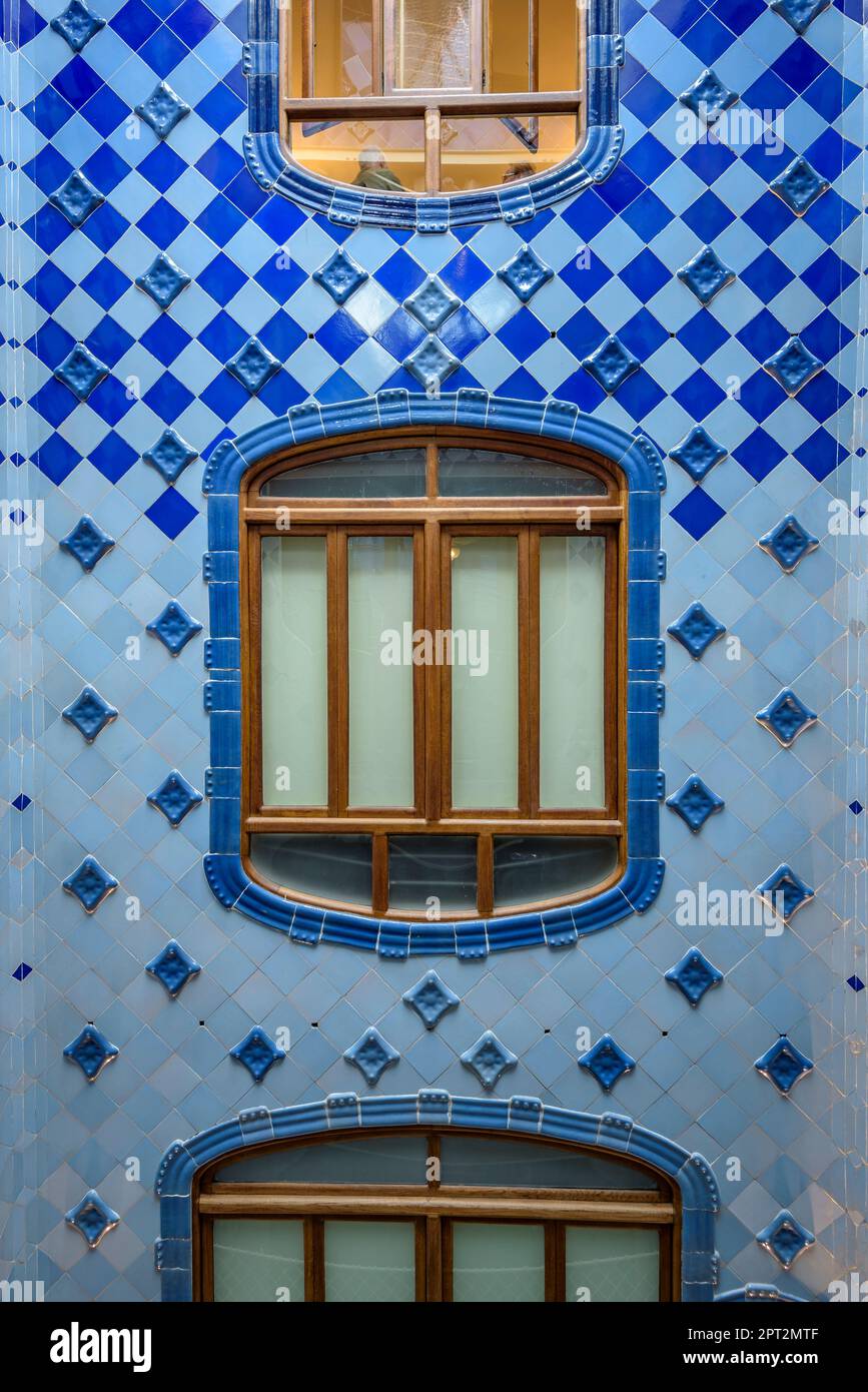 Inner courtyard of Casa Batlló decorated with a gradient mosaic from ...