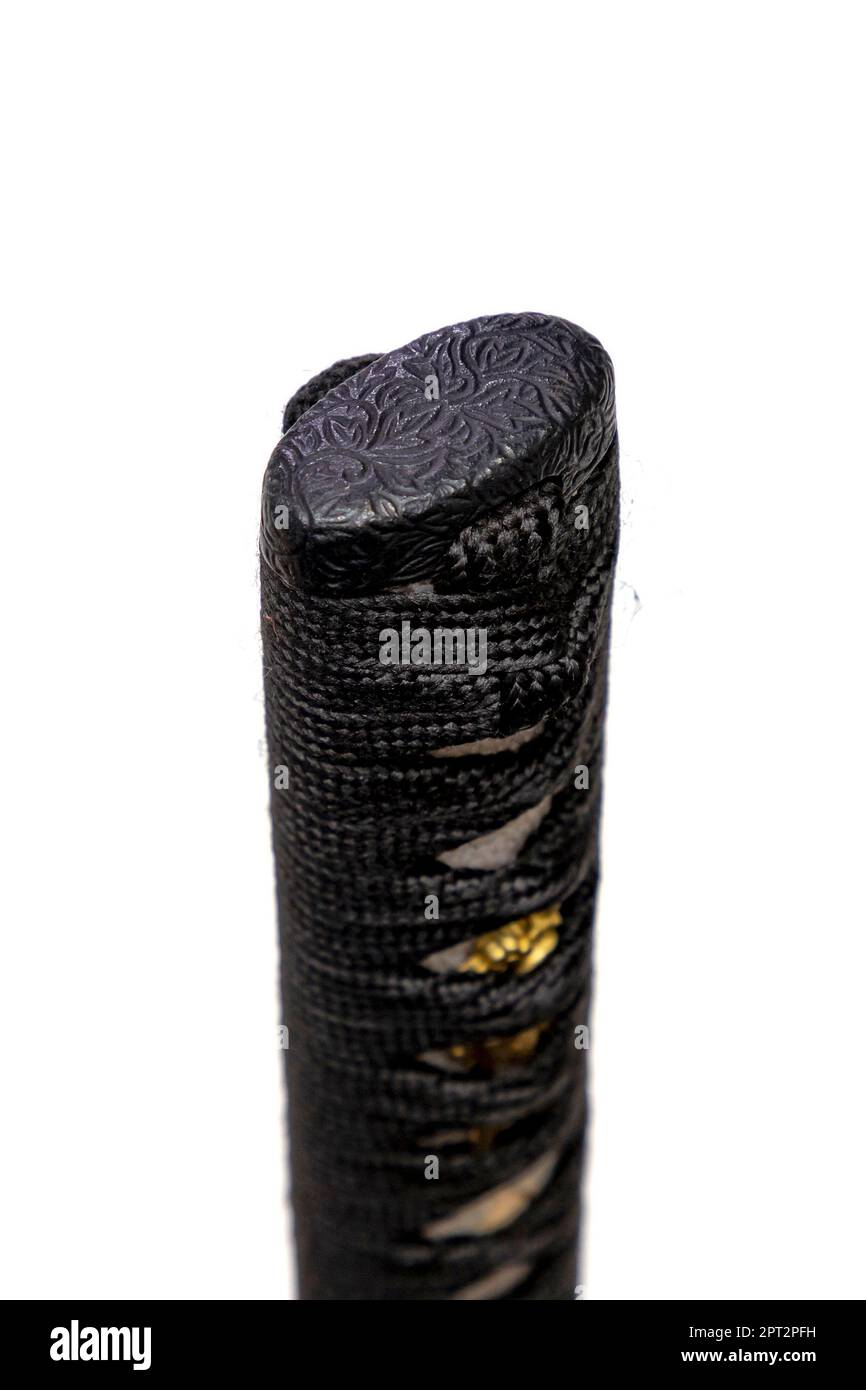 Close up the Kashira: butt cap (or pommel) made of steel on the end of ...