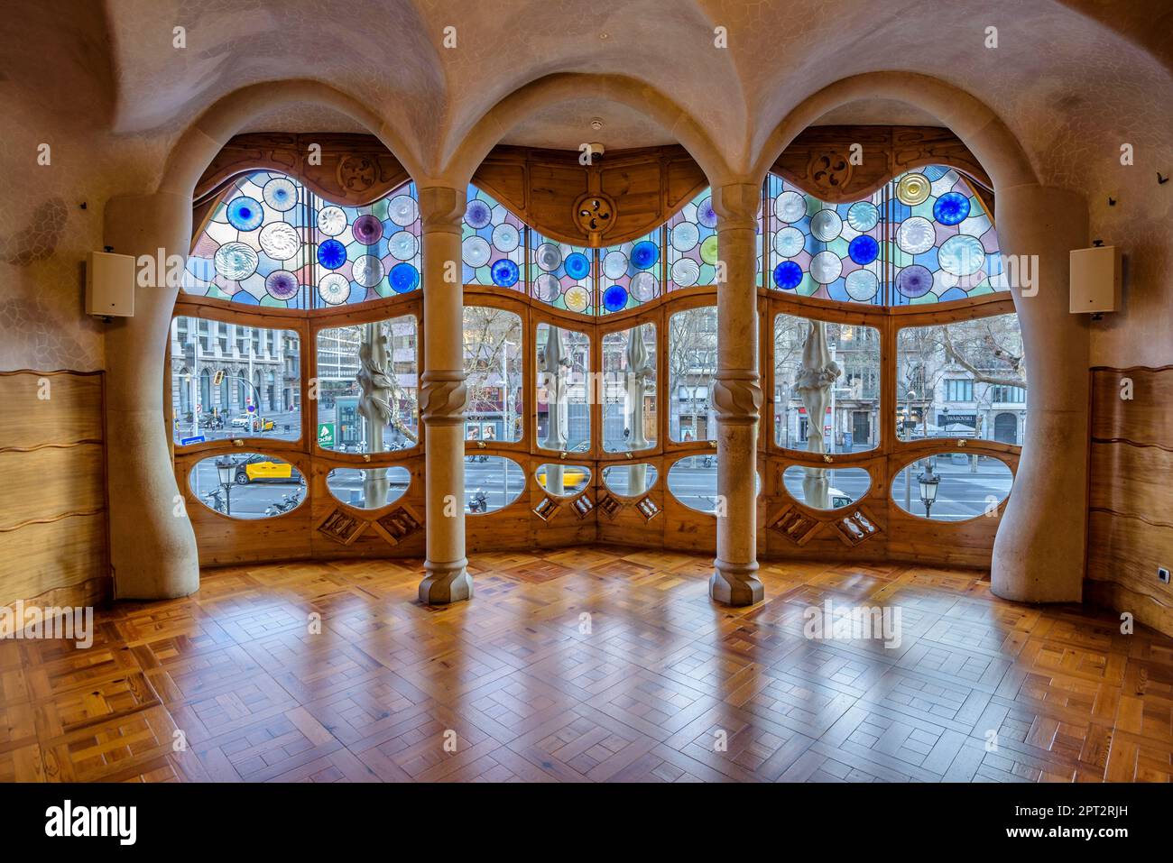 Large window with stained glass windows and columns in the main hall of ...