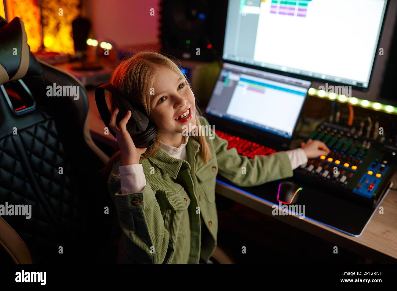 Excited successful young girl preteen child audio engineer mixing sound ...