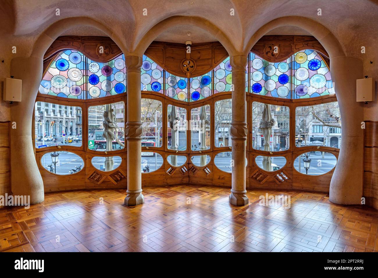 Large window with stained glass windows and columns in the main hall of ...