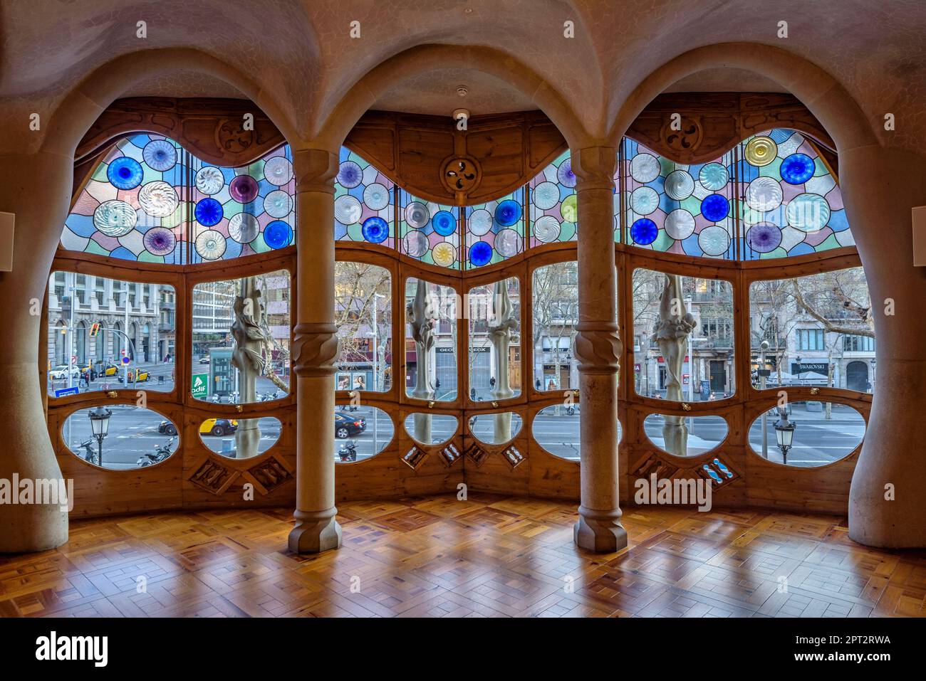 Large window with stained glass windows and columns in the main hall of ...