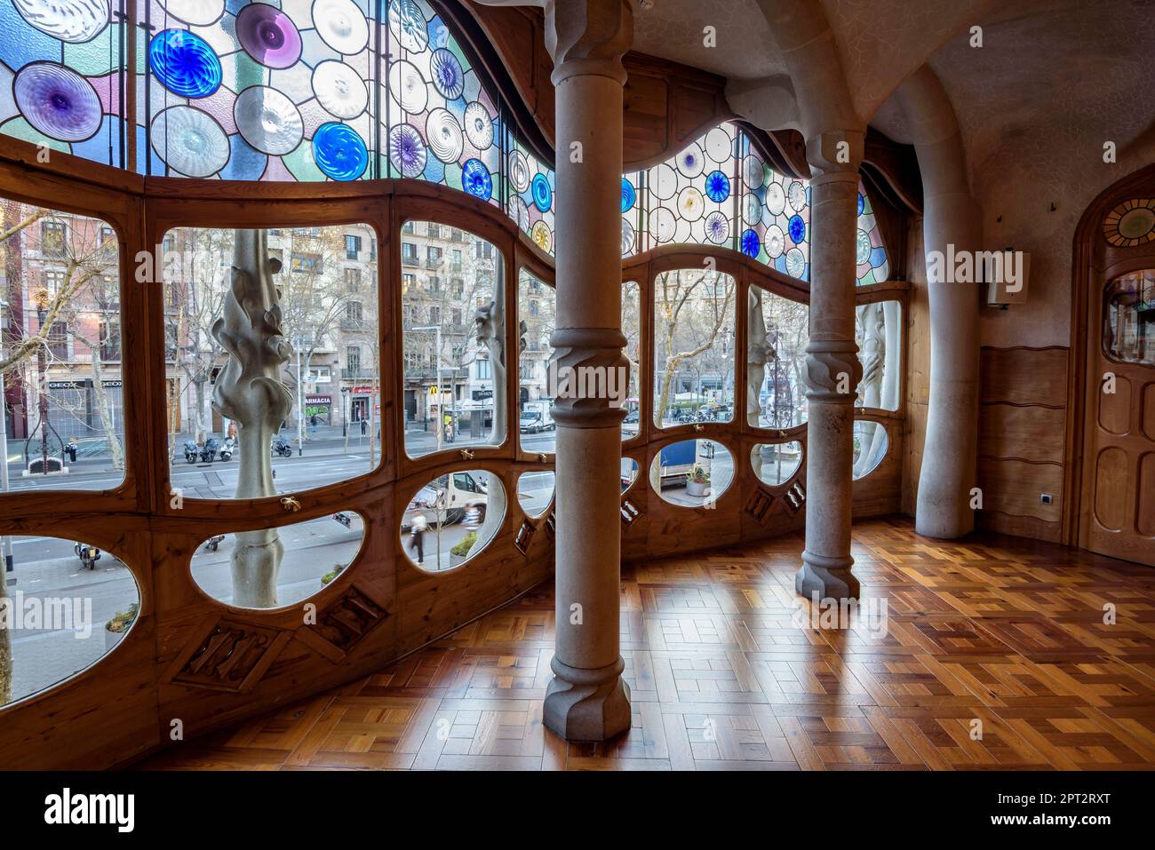 Large window with stained glass windows and columns in the main hall of ...