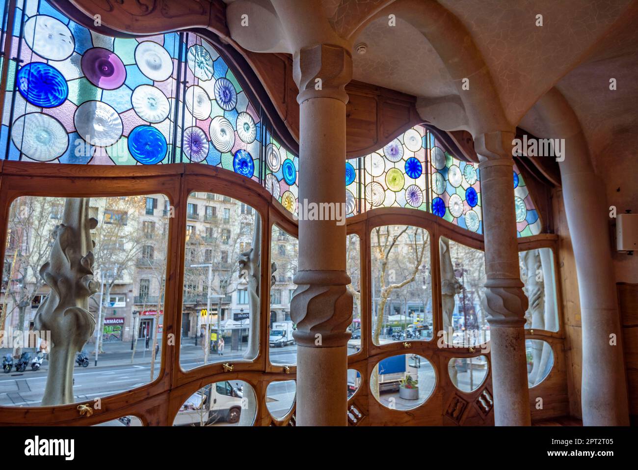 Large window with stained glass windows and columns in the main hall of ...