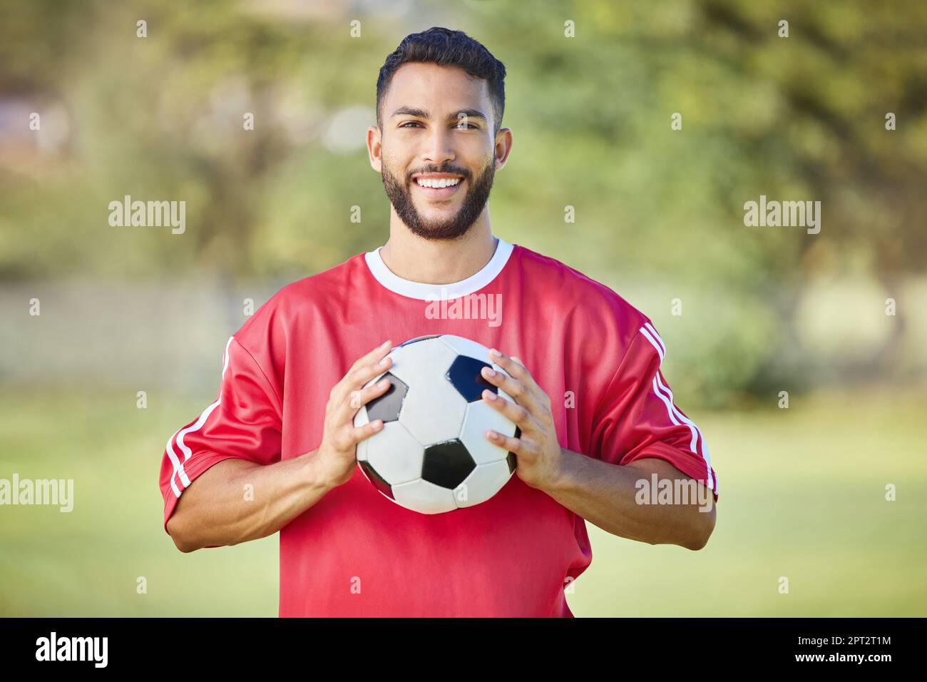 Sports man, soccer player and soccer field training with a soccer ball ...