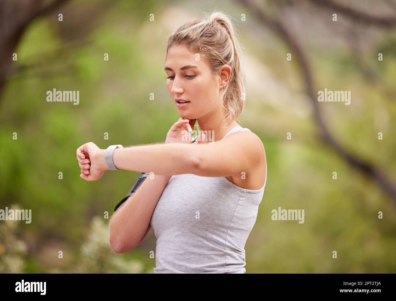 Fitness, woman and watch checking time in nature for exercise, workout ...