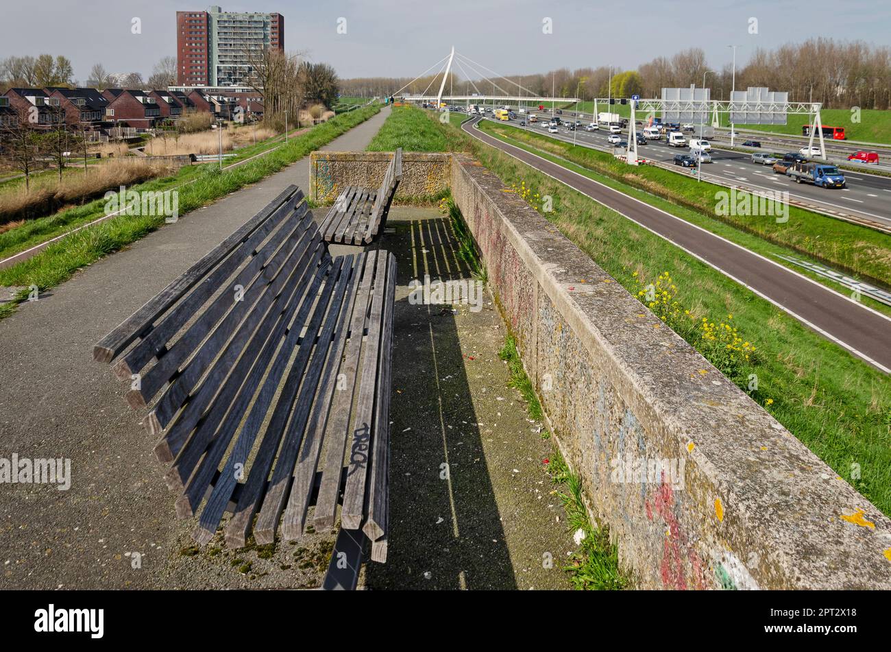 Rotterdam, The Netherlands, April 5, 2023: wooden bench on the sound ...