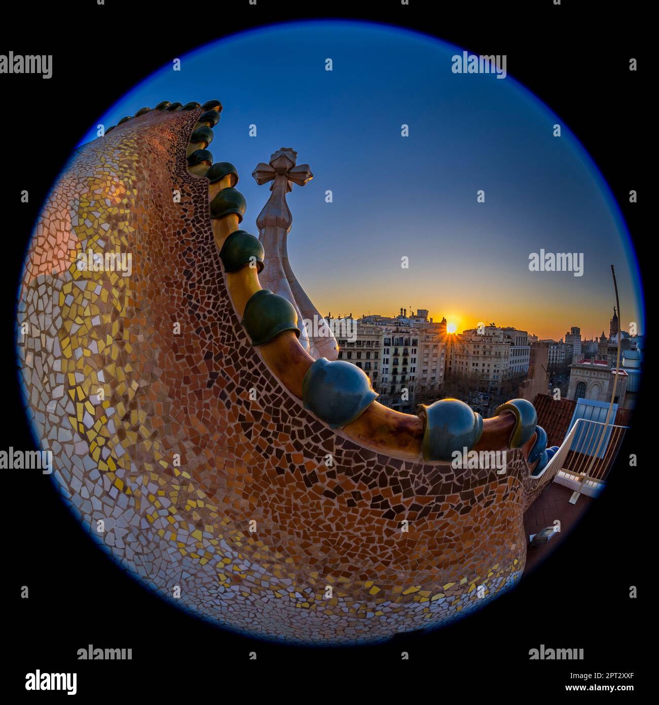 Roof of Casa Batlló with the shape of dragon scales and the cross of ...
