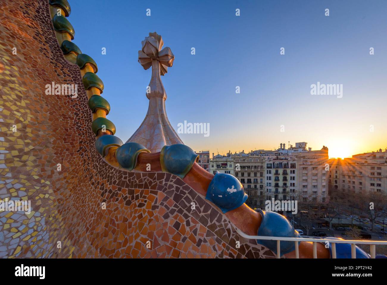 Roof of Casa Batlló with the shape of dragon scales and the cross of ...