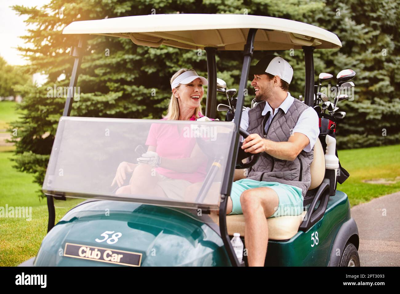 Women driving golf cart on hi-res stock photography and images - Alamy