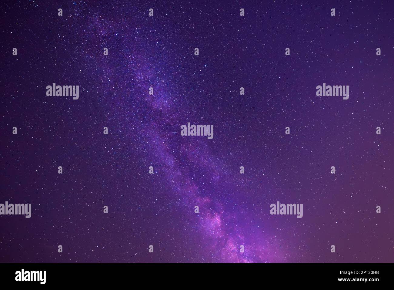 view on Milky Way galaxy in dark purple night sky Stock Photo - Alamy