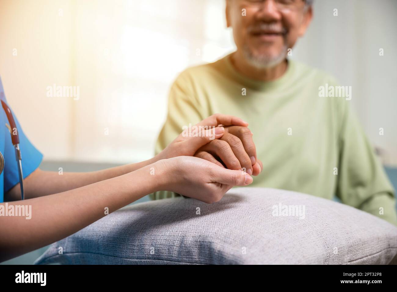 International Day for the Elderly. Caring nurse helping elderly old man ...
