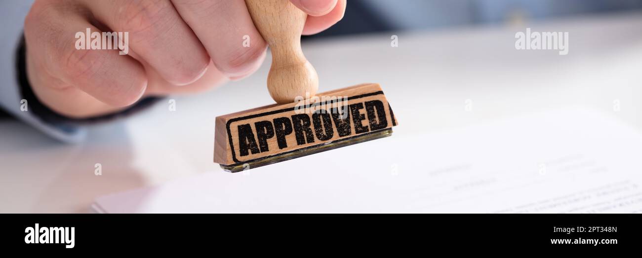 Permit Approve Stamp. Person Hand At Work Stock Photo - Alamy