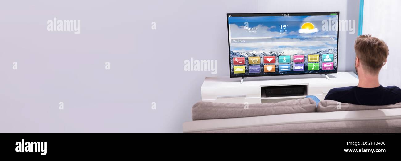 Watching TV In Living Room. Weather Television Channel Stock Photo - Alamy