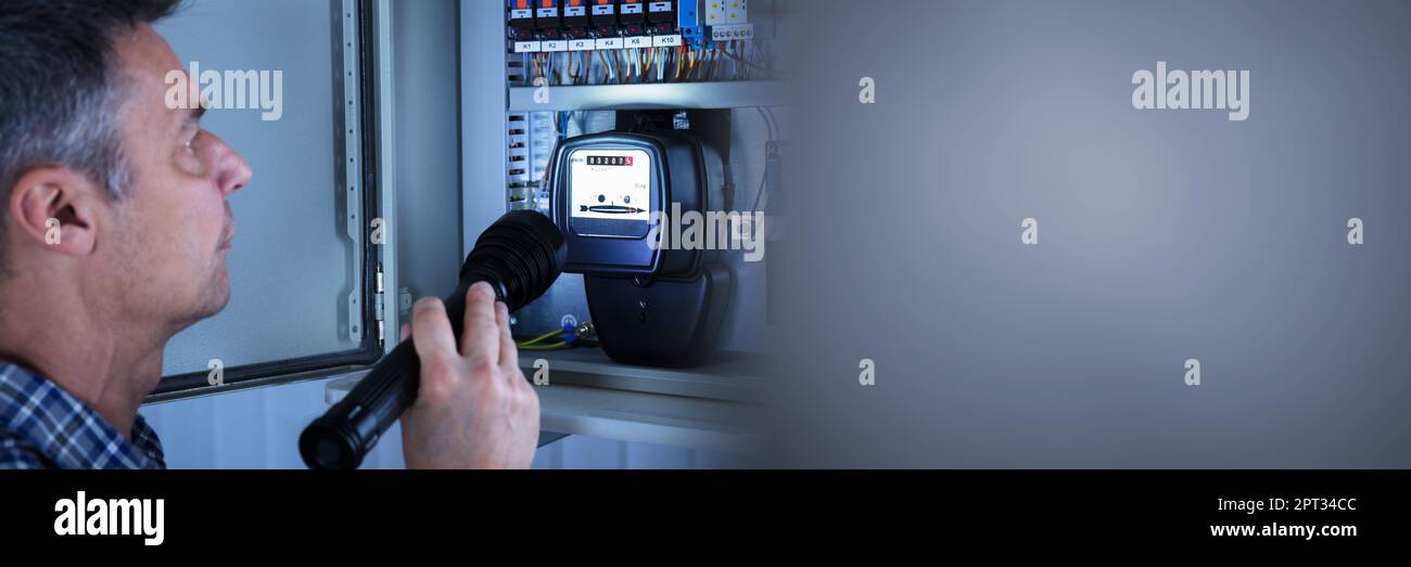 Man Reading Electric Meter With Flashlight. Electrician Panel Check ...