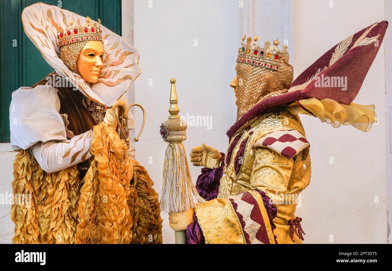 Venice Carnival costumed participants pose in medieval baroque costumes ...