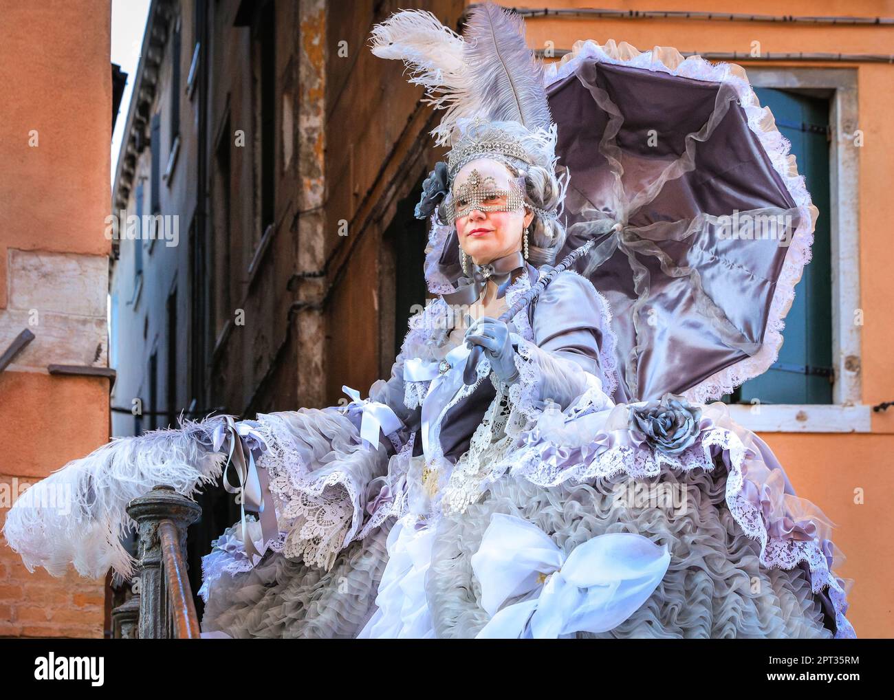 Venice Carnival costumed woman in elegant medieval baroque costume ...